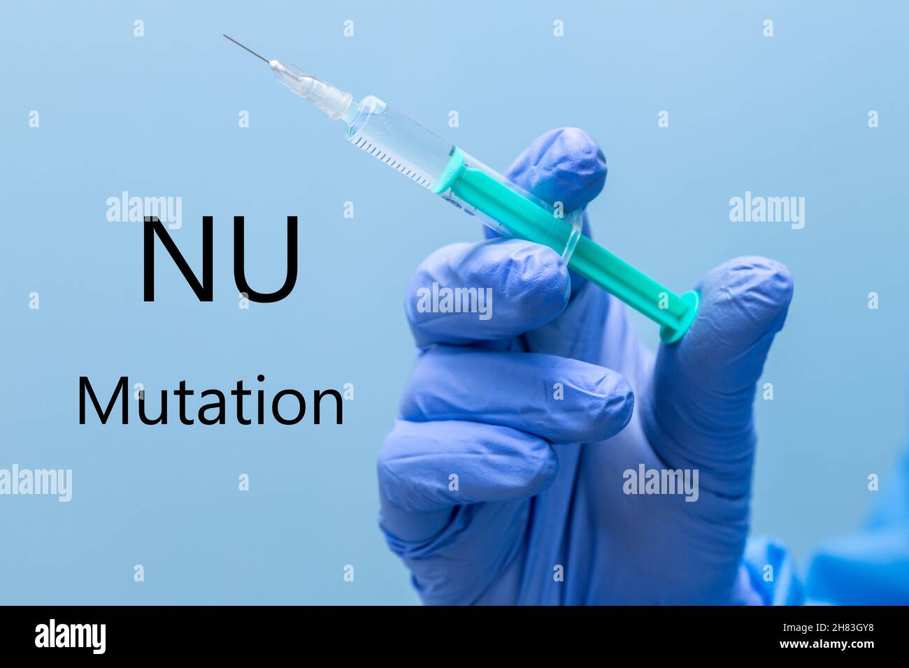 A new type of coronavirus. Medic's hand with a syringe and the ...