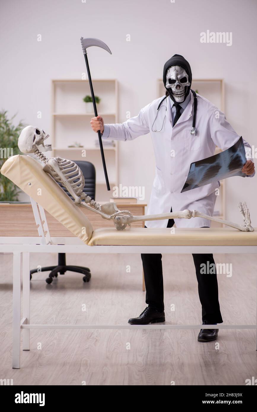 Devil doctor radiologist examining skeleton patient at the hospital ...