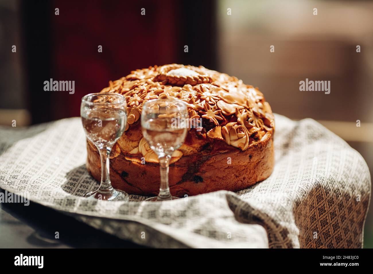 big delicious beautiful loaf with two glasses of alcohol Stock Photo ...