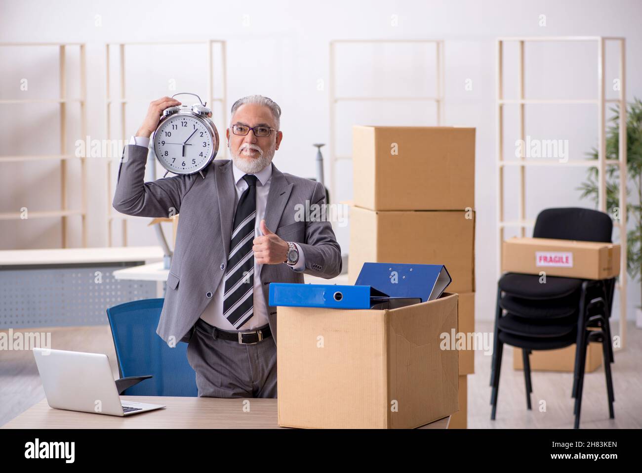 Old employee in relocation concept Stock Photo - Alamy
