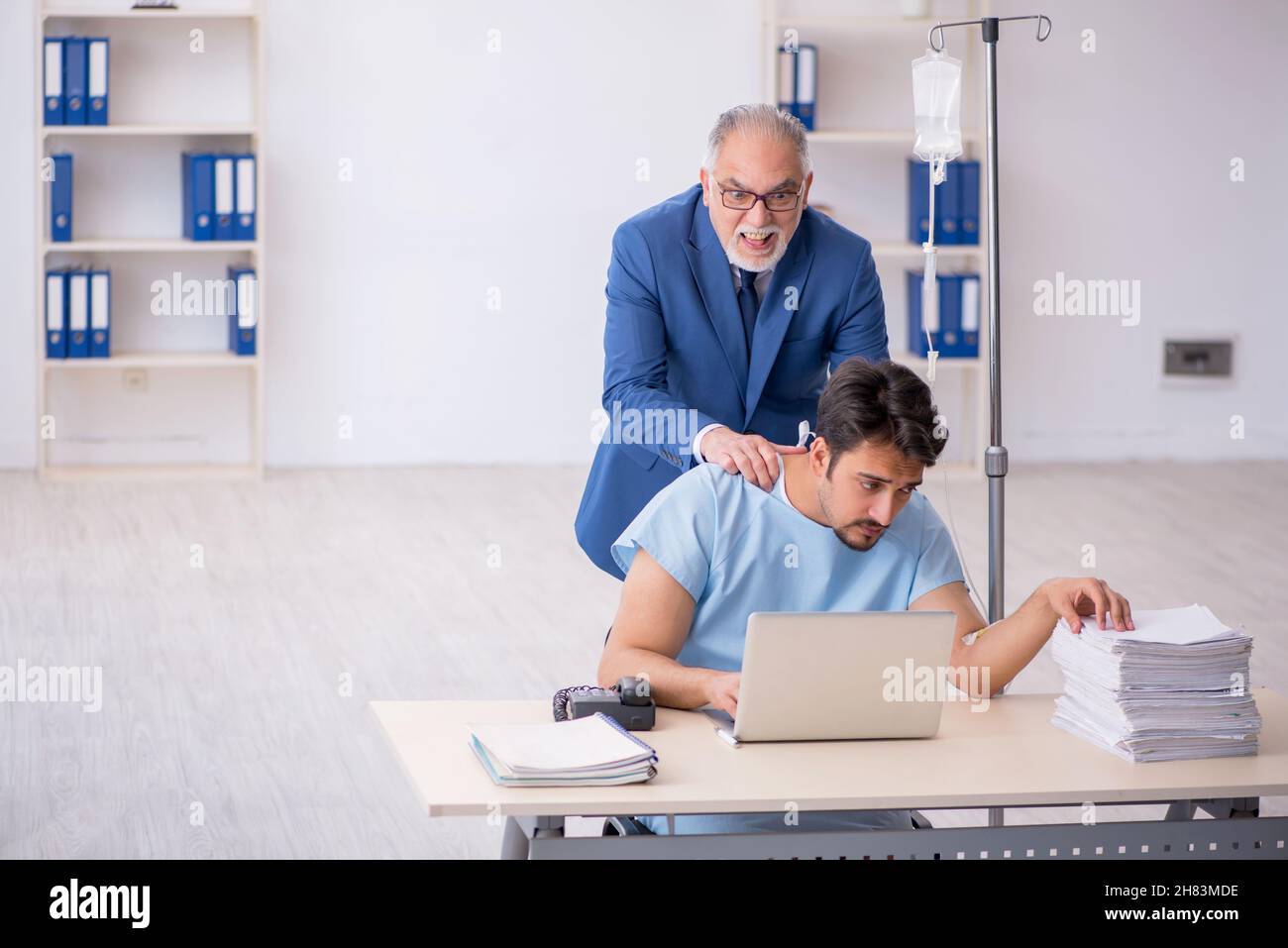 Young employee feeling bad at workplace Stock Photo - Alamy