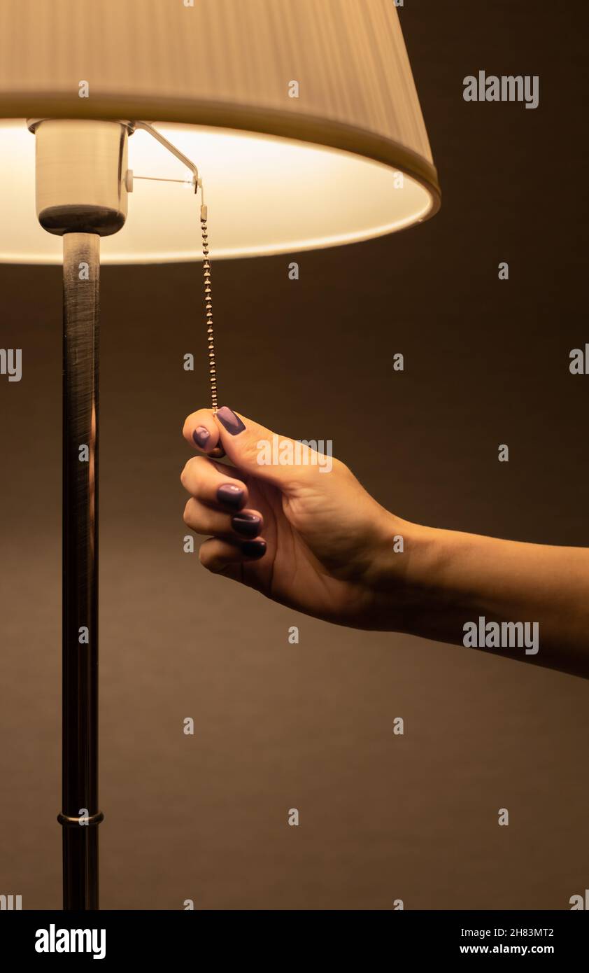 lamp night light by the rope which the hand pulls. High quality photo ...