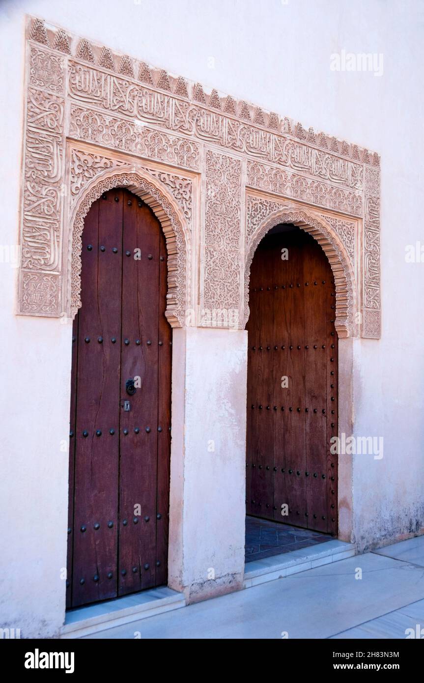 Arabesque and calligraphy Moorish arched studded wood doors at the ...