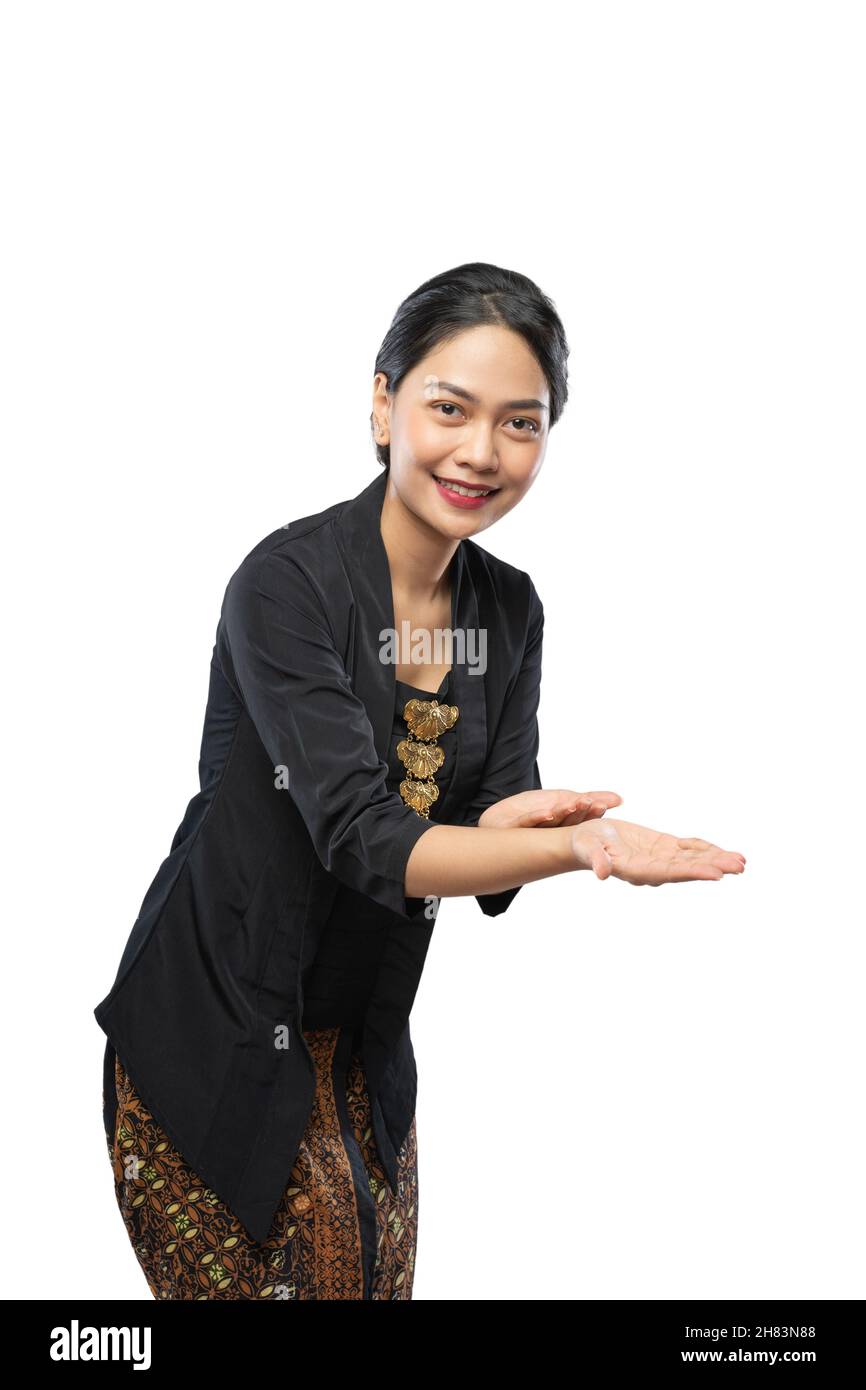 beautiful woman wearing traditional Javanese clothes presenting Stock ...