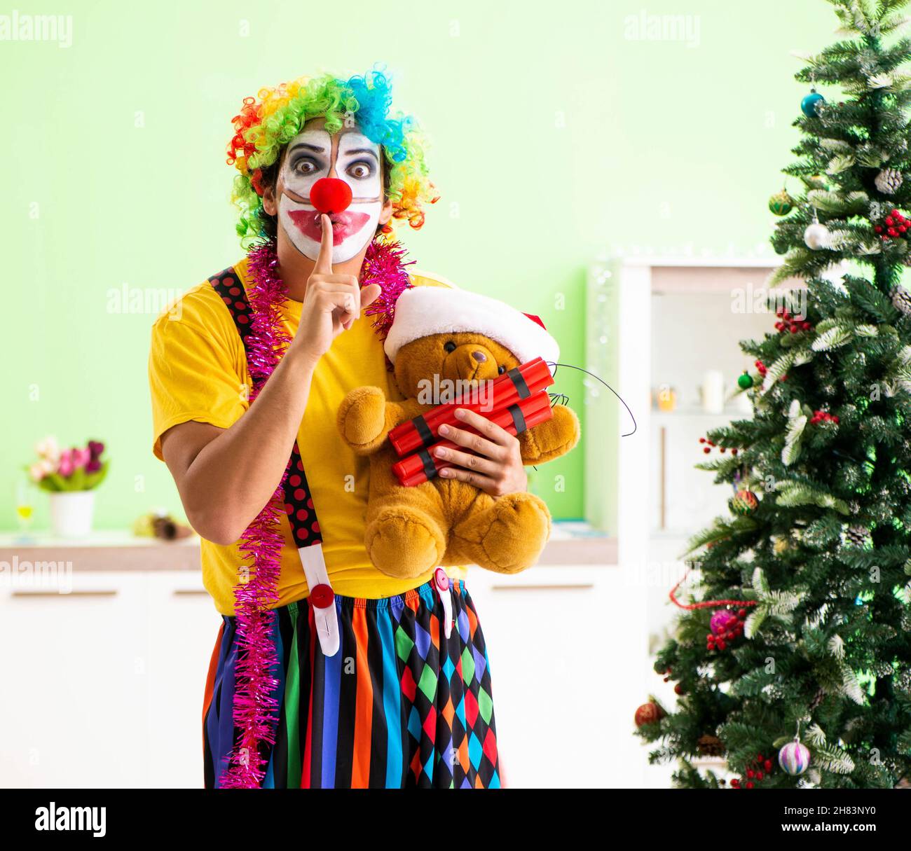 The funny clown in christmas celebration concept Stock Photo - Alamy