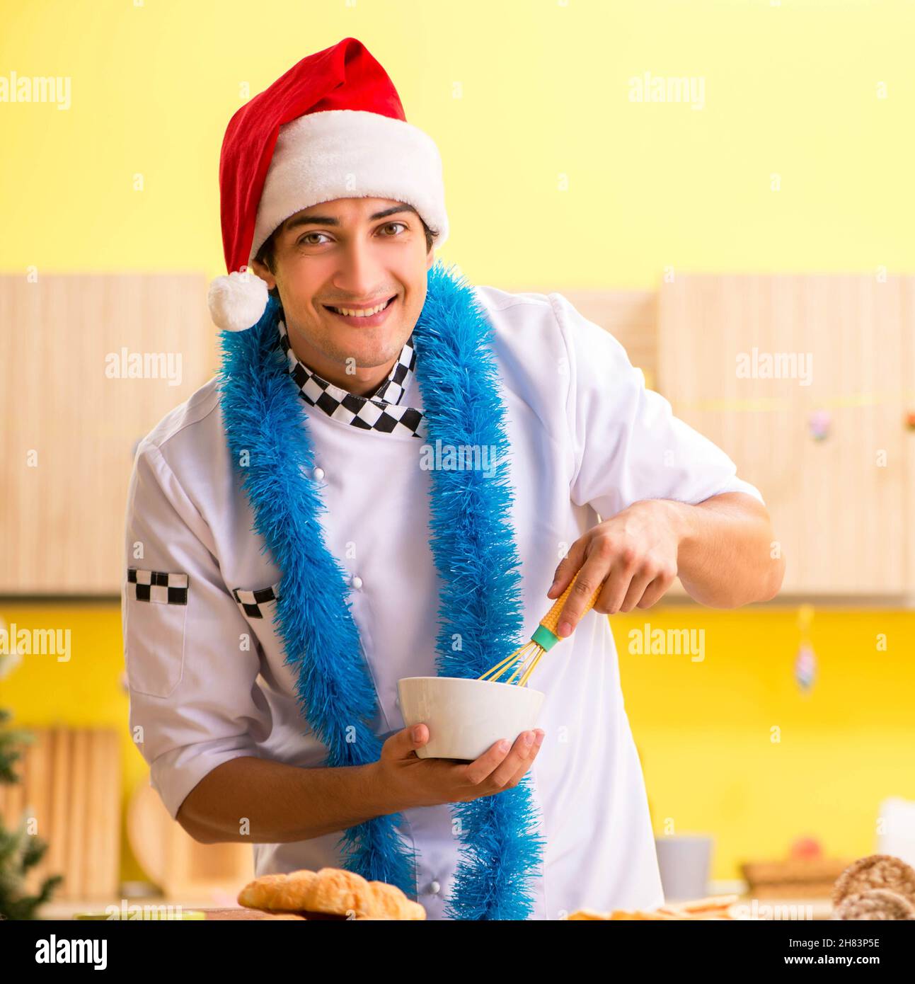 The young chef husband working in kitchen at christmas eve Stock Photo ...