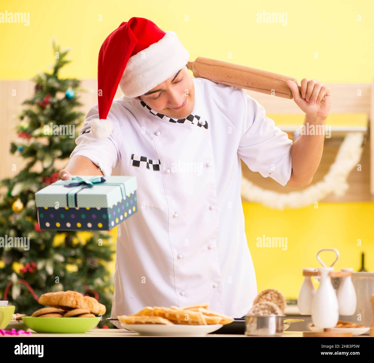 The young chef husband working in kitchen at christmas eve Stock Photo ...