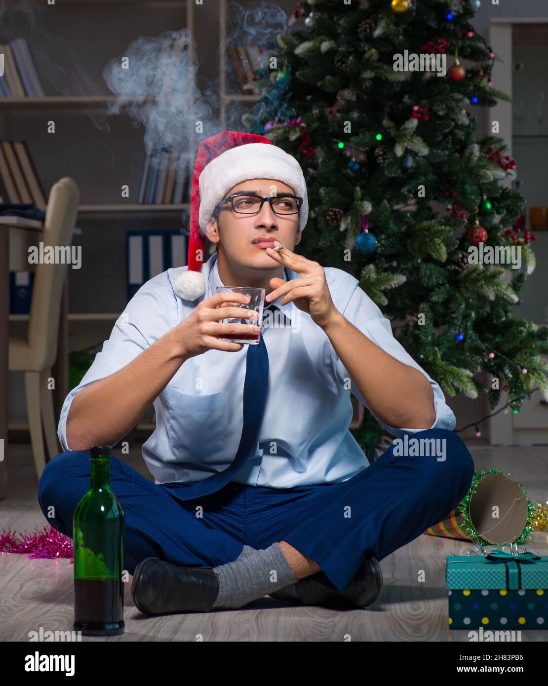 The businessman celebrating christmas at home alone Stock Photo - Alamy