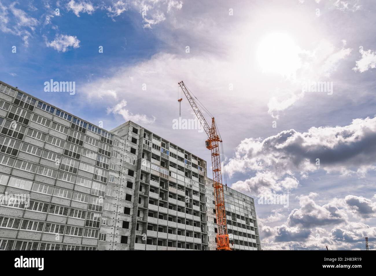 Multi-storey housing and highrise cranes Stock Photo - Alamy