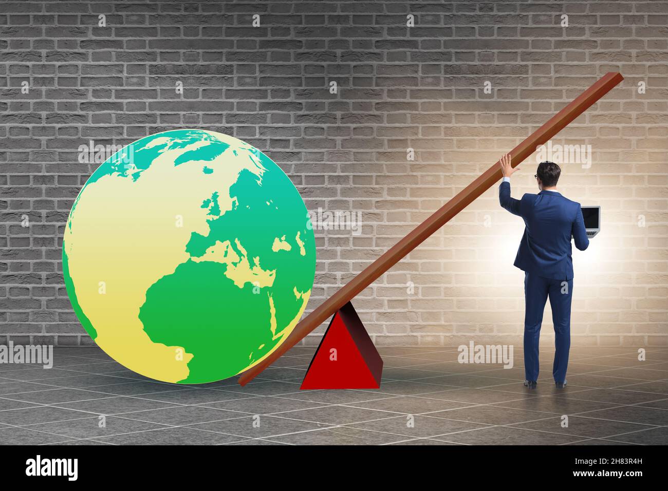 Businessman lifting the earth in the challenge concept Stock Photo - Alamy