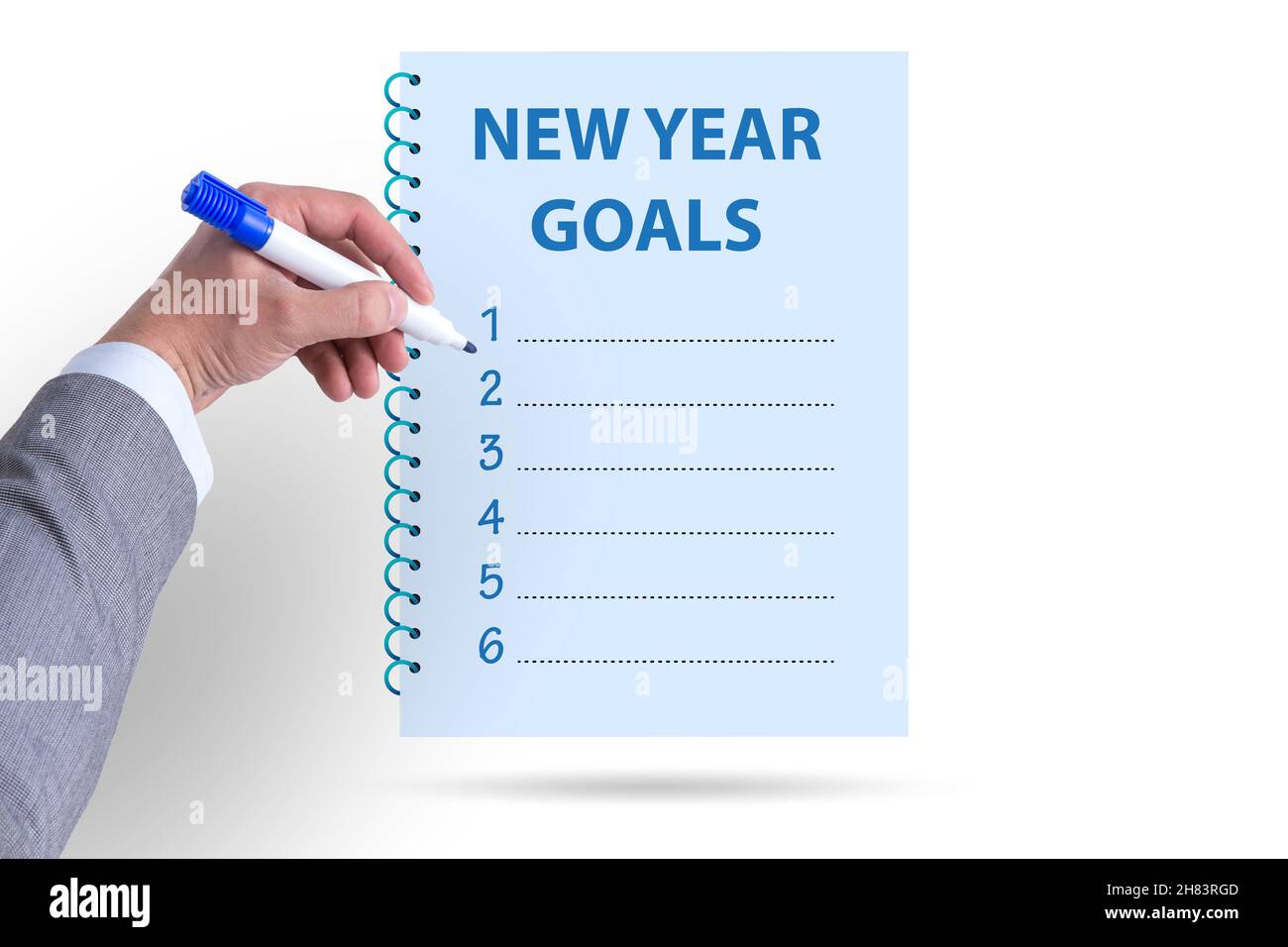 Businessman writing new year resolution Stock Photo - Alamy