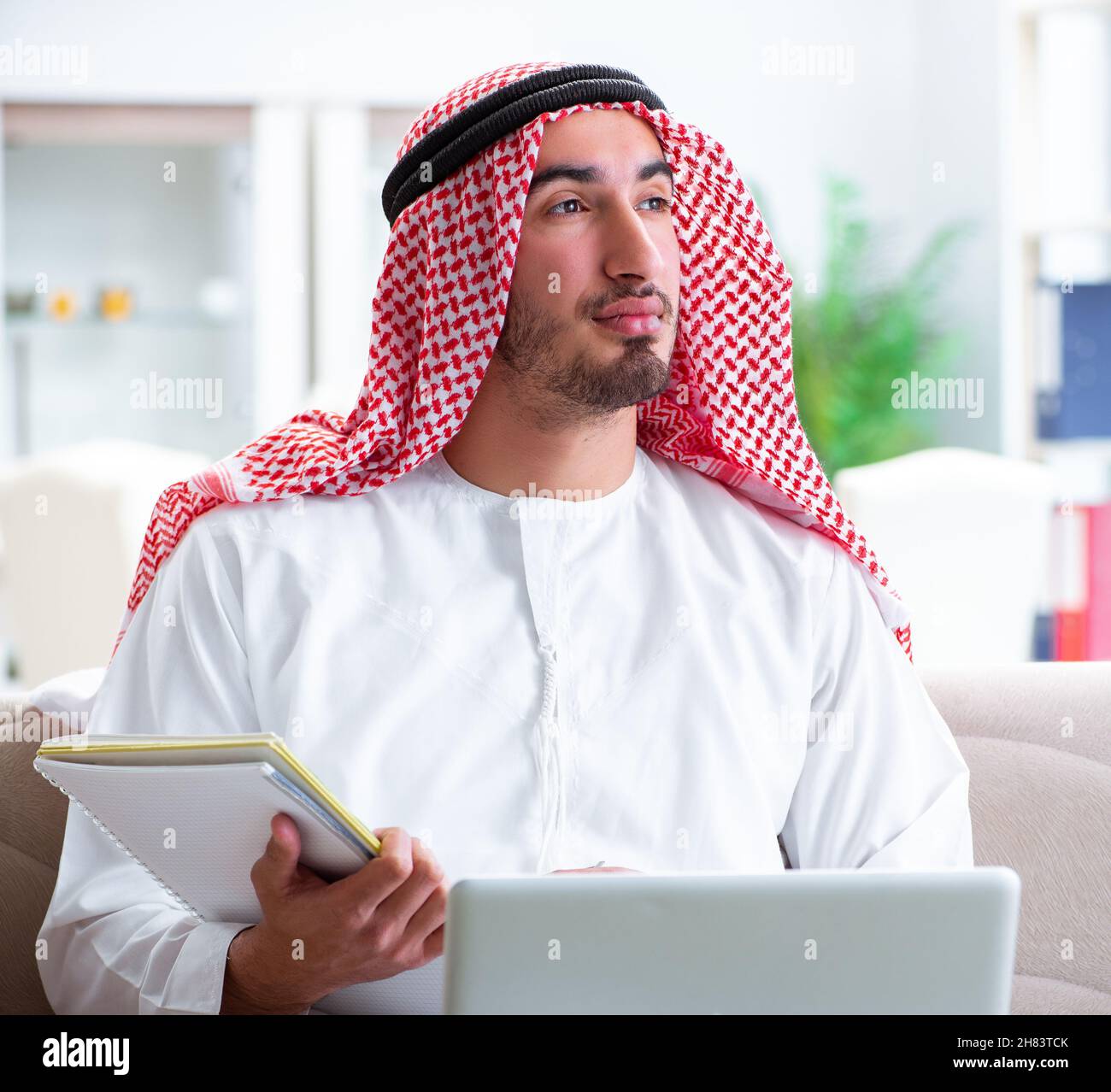 The arab man working at home on his work Stock Photo - Alamy
