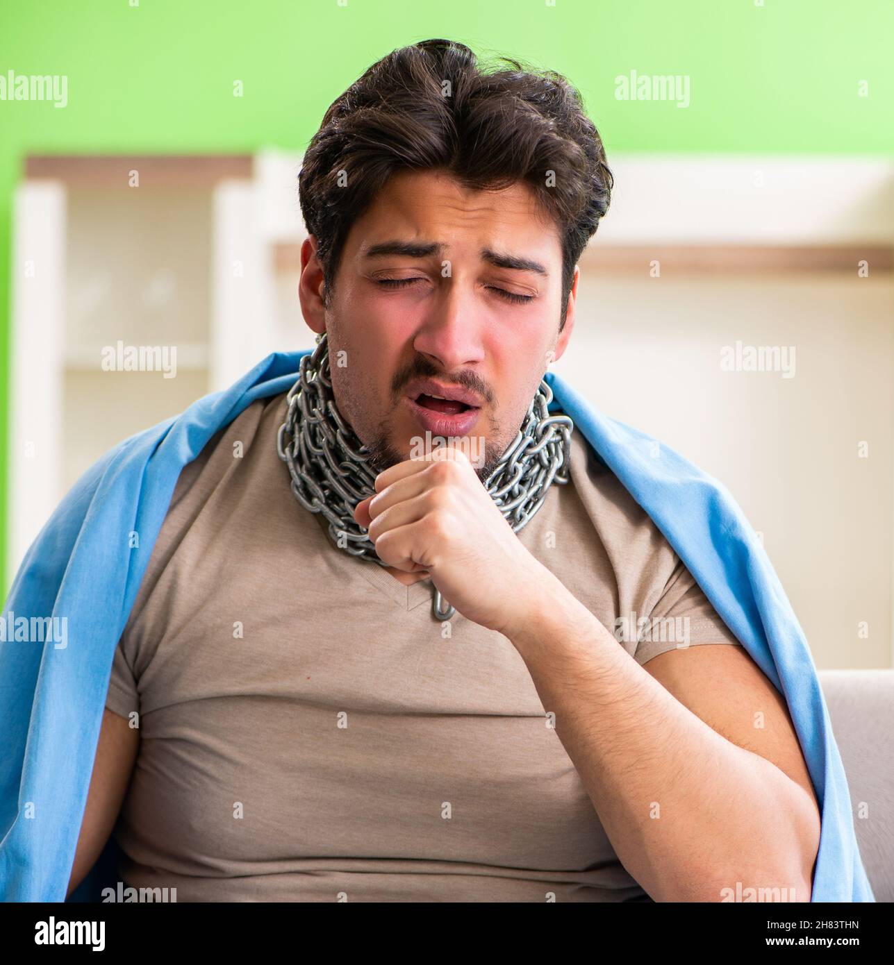 The sick young man suffering from flu at home Stock Photo - Alamy