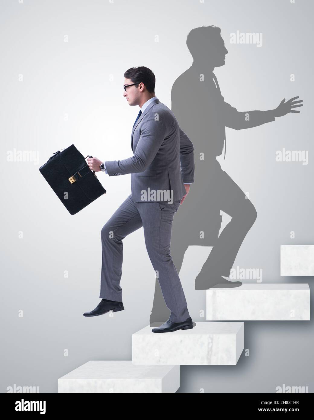 The businessman and his shadow in business concept Stock Photo - Alamy