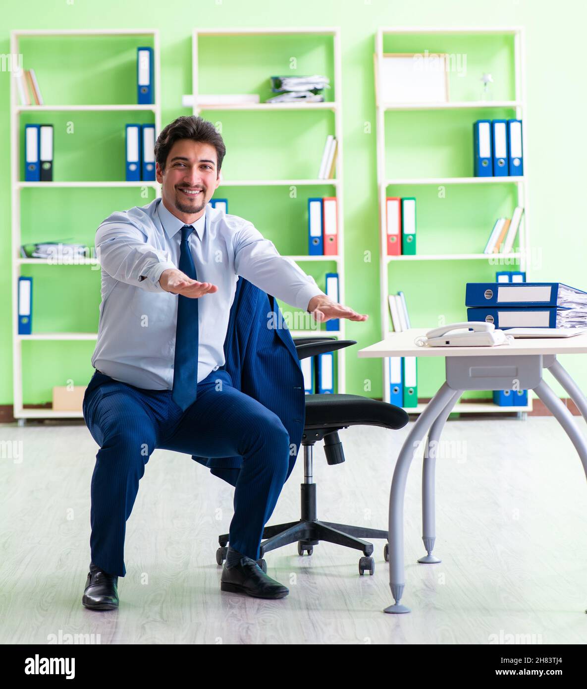 The employee doing exercises during break at work Stock Photo - Alamy