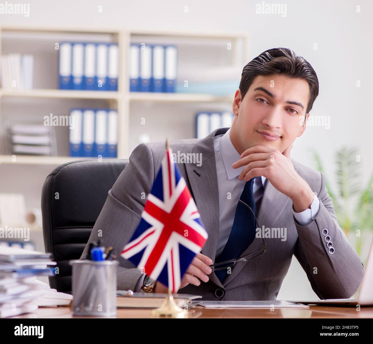 The businessman with british flag in the office Stock Photo - Alamy