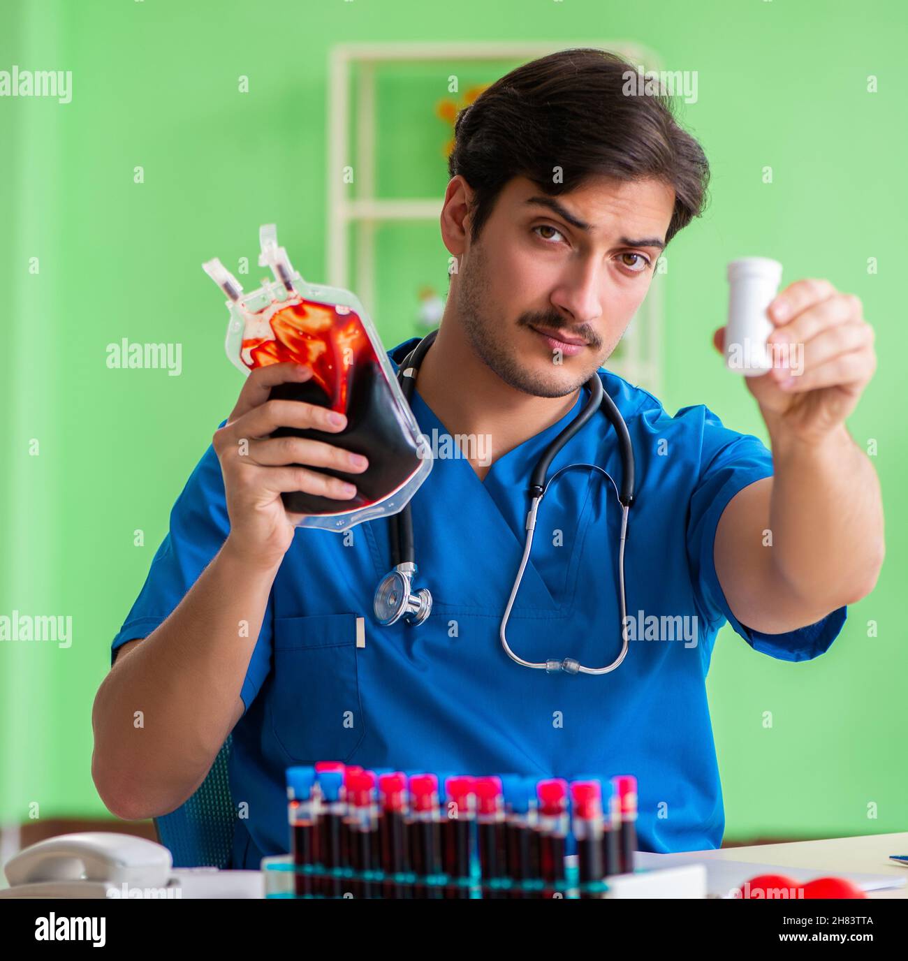 Doctor doing blood analysis in lab Stock Photo - Alamy