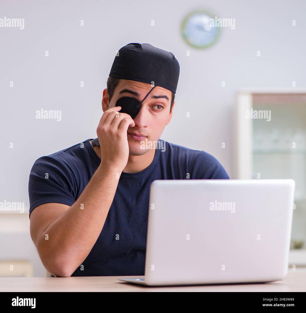 The digital security concept with pirate at computer Stock Photo - Alamy