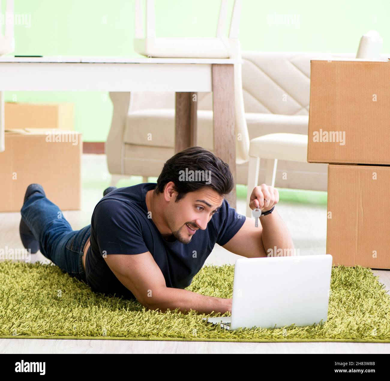 The man moving house with boxes Stock Photo - Alamy