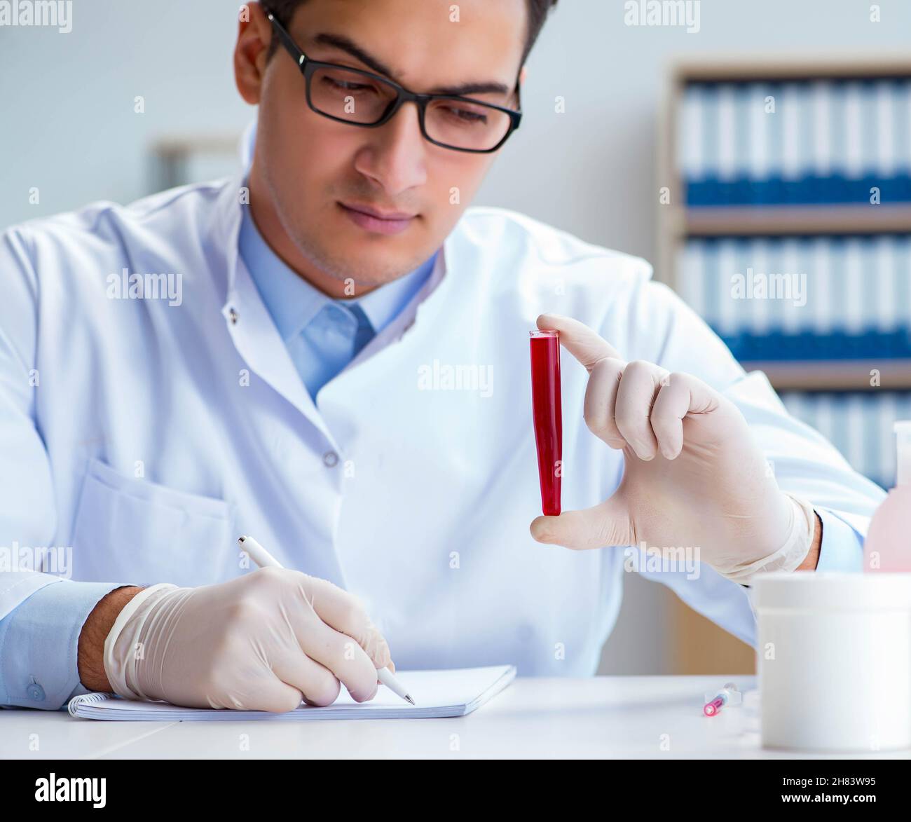 The doctor working with blood samples Stock Photo - Alamy