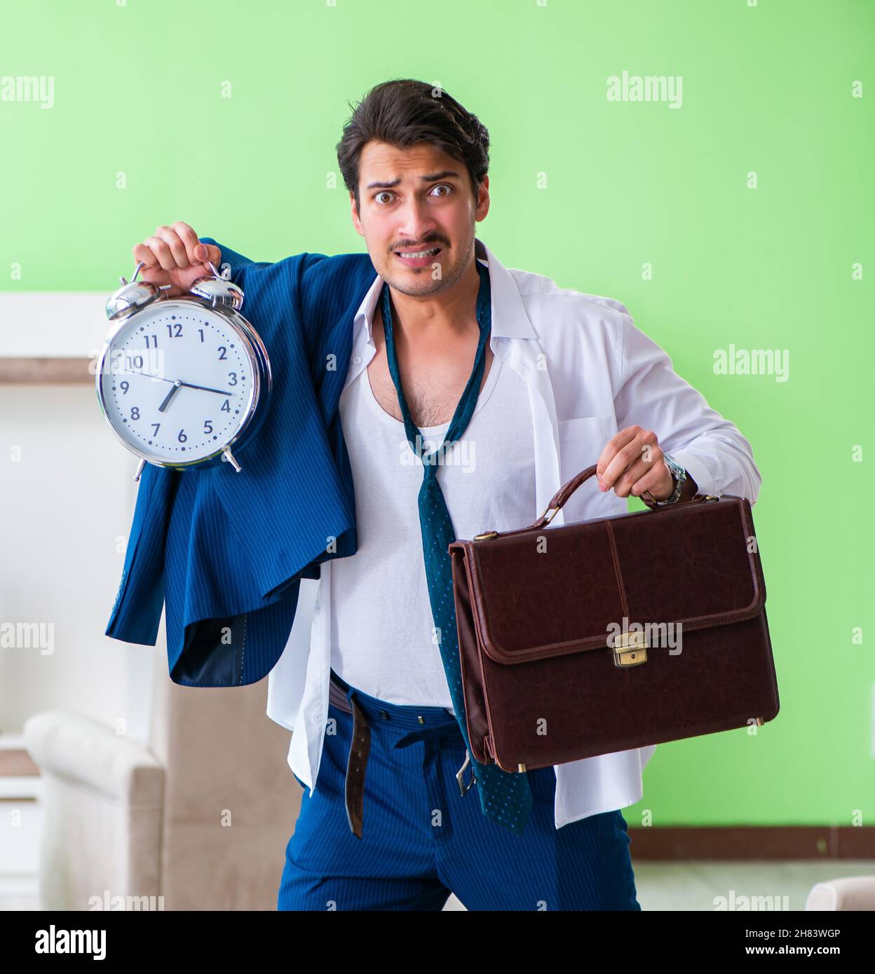 The man dressing up and late for work Stock Photo - Alamy