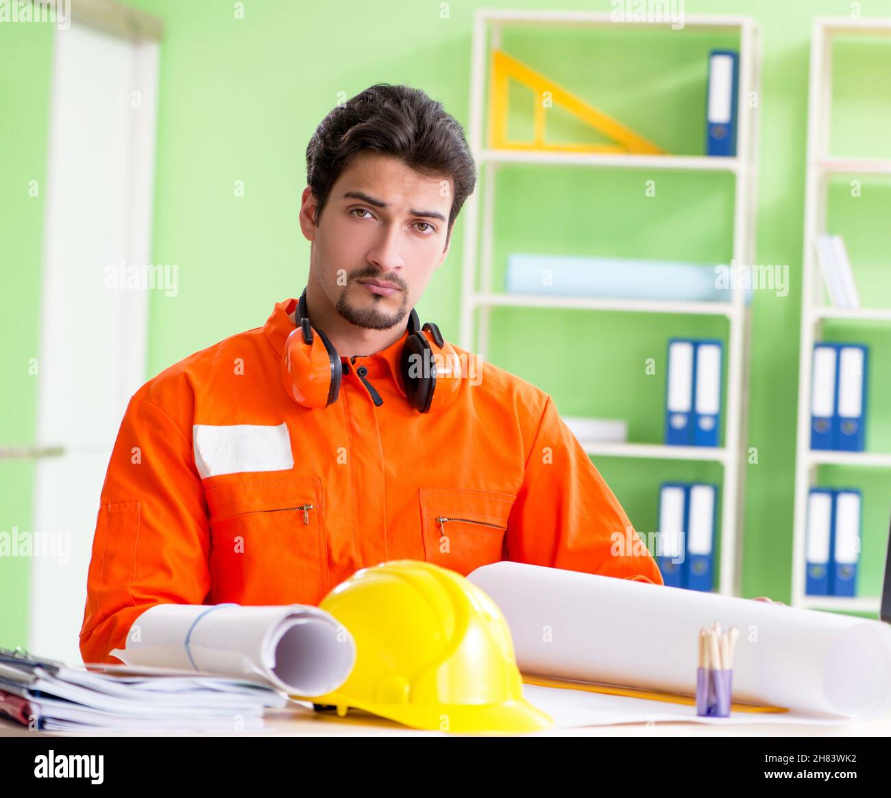 The construction supervisor planning new project in office Stock Photo ...