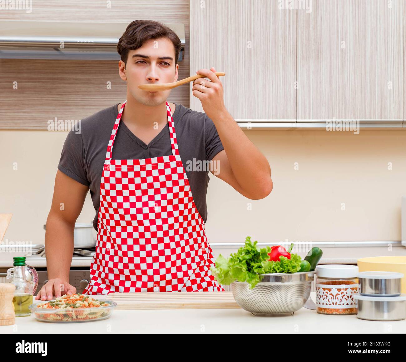 The man male cook preparing food in kitchen Stock Photo - Alamy