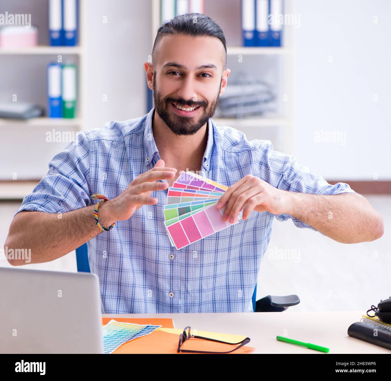 The young designer working in his studio on new project Stock Photo - Alamy