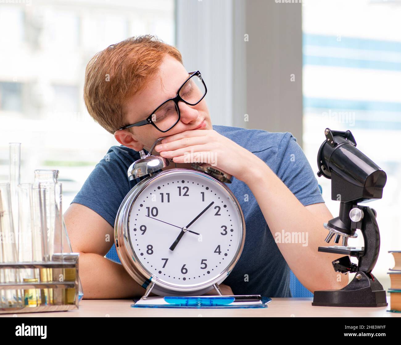 The young student preparing for chemistry exam Stock Photo - Alamy