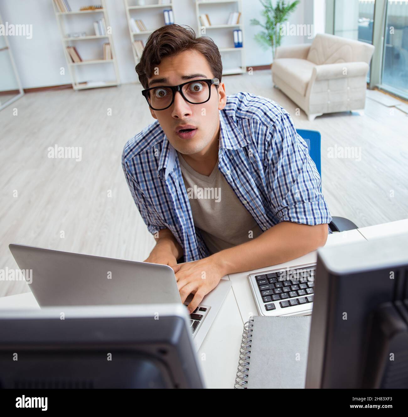 The young trader monitoring markets on screens Stock Photo - Alamy