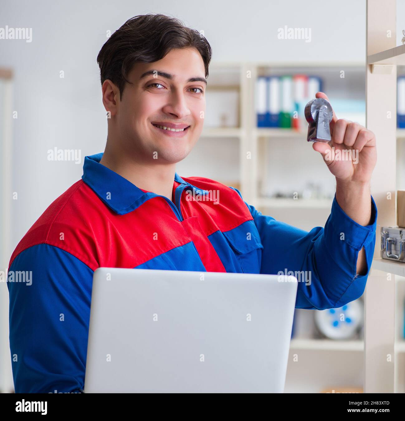 The man working in the postal warehouse Stock Photo - Alamy