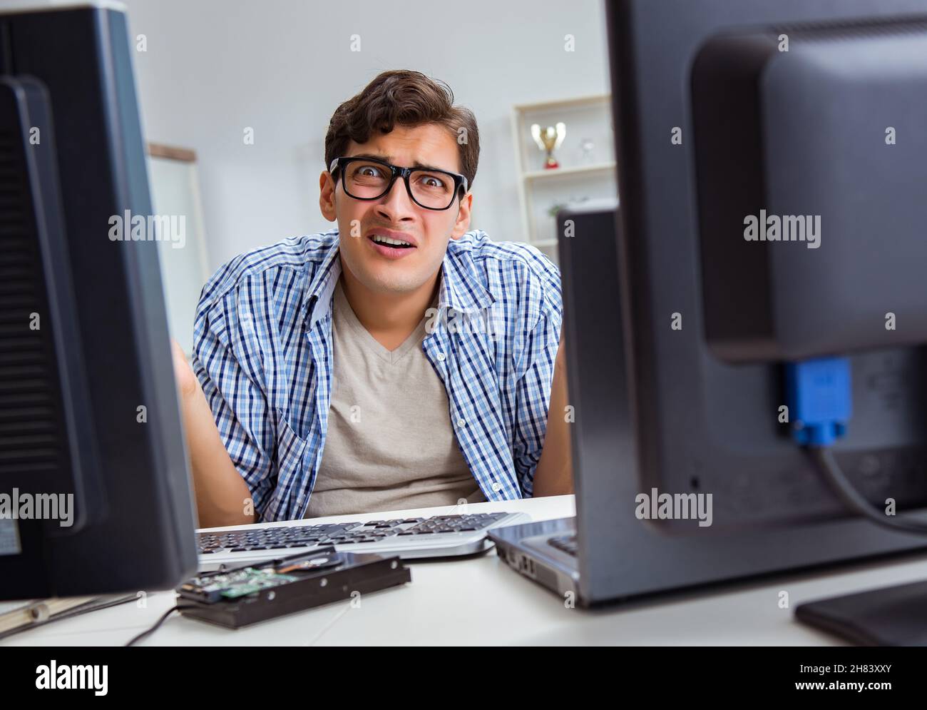 The young trader monitoring markets on screens Stock Photo - Alamy
