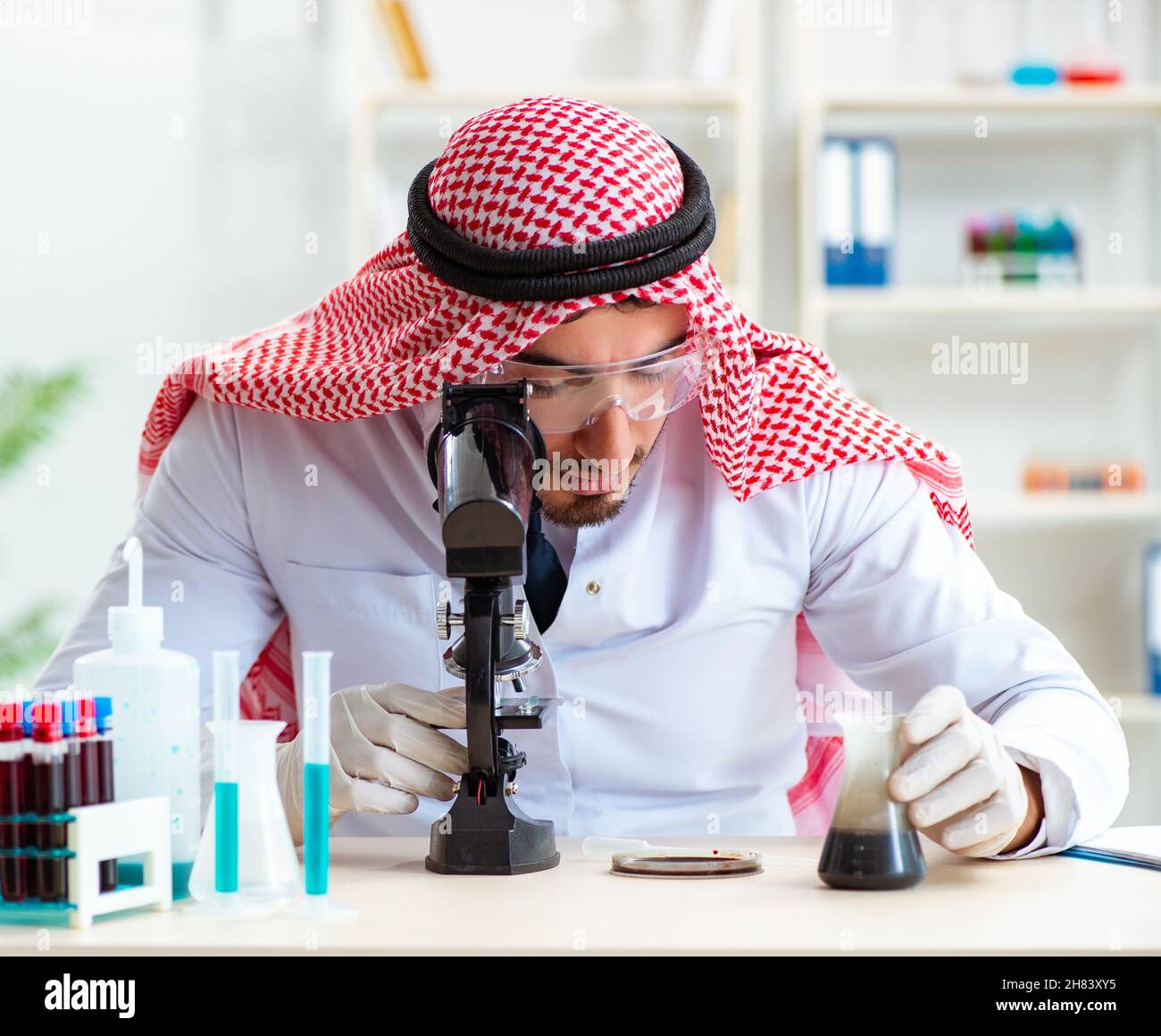 The arab chemist scientist testing quality of oil petrol Stock Photo ...