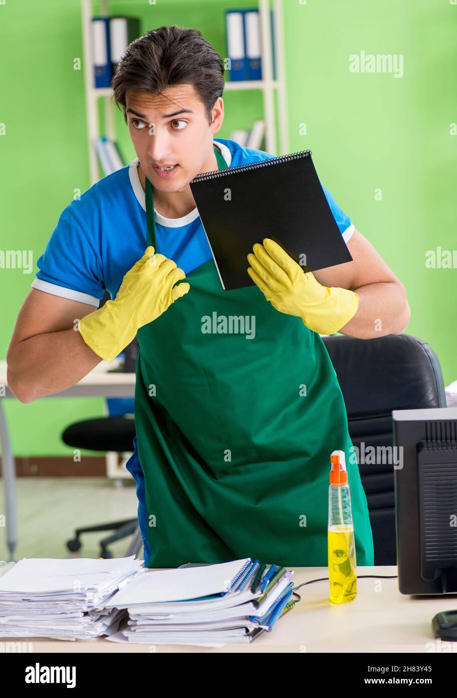 The male spy under cleaner cover stealing confidential documents Stock ...