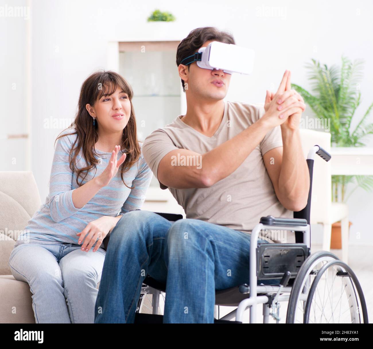 The disabled man with virtual glasses Stock Photo - Alamy