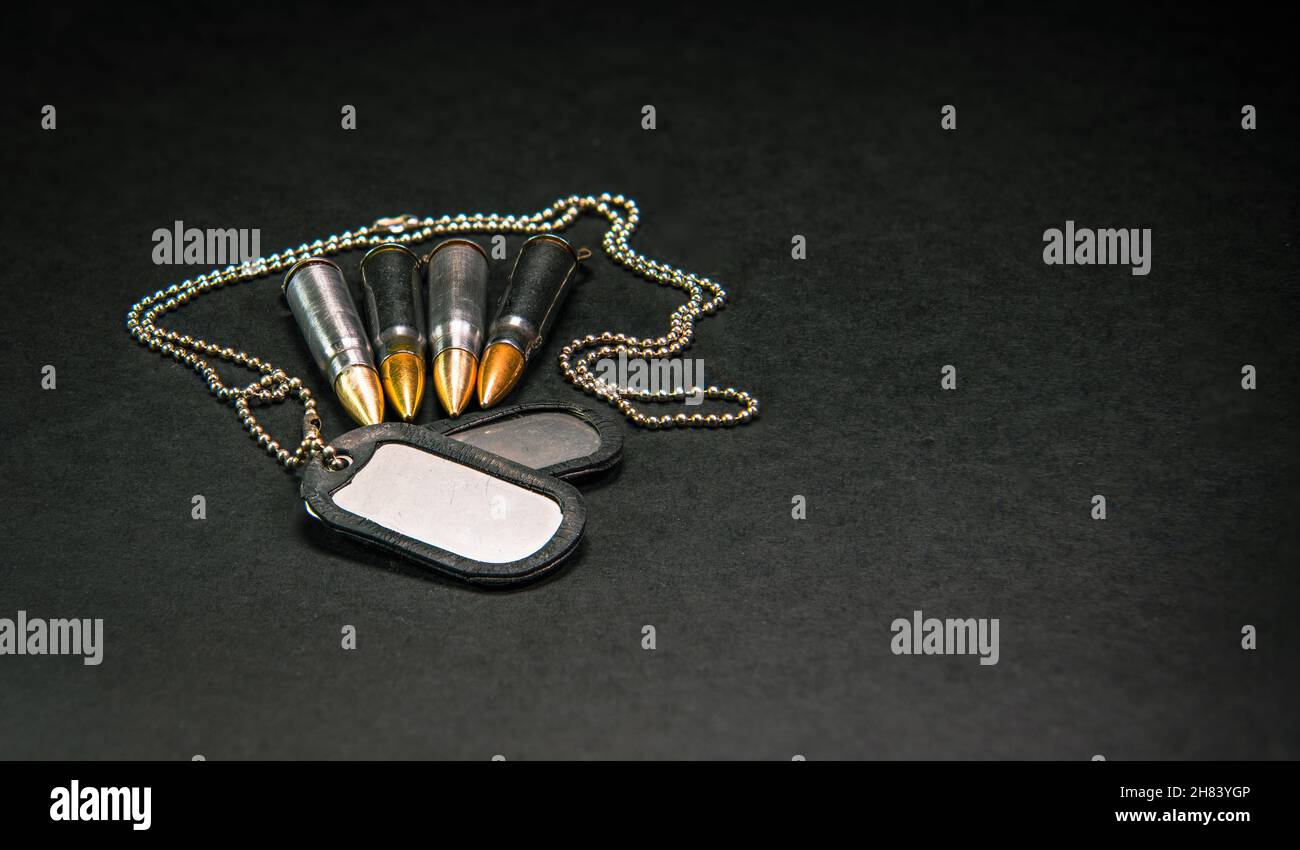 Bullet isolated on black background with reflexion. Rifle bullets close ...