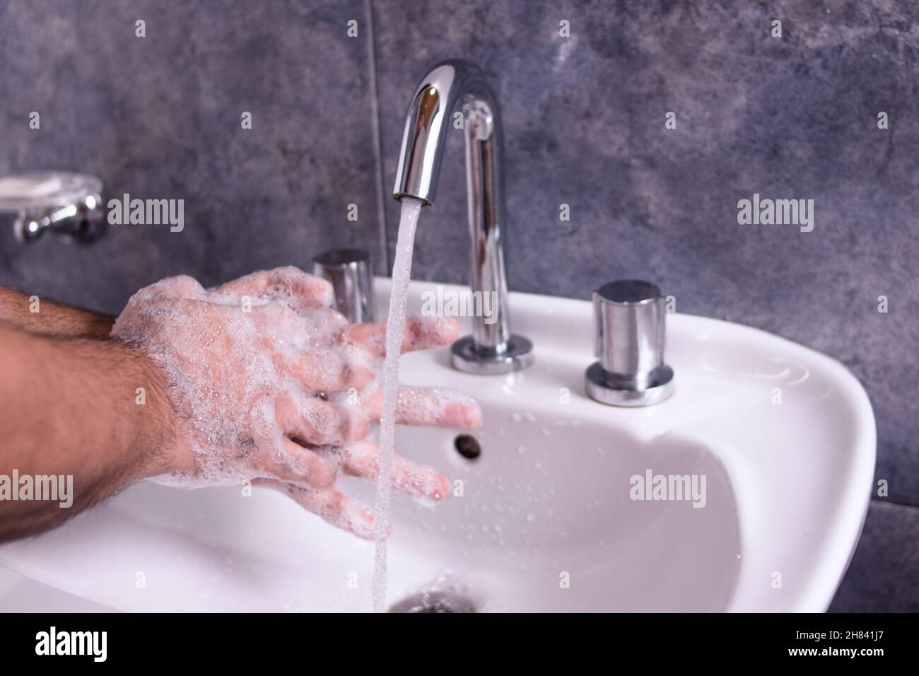 Man washing hands thoroughly with soap hi-res stock photography and ...