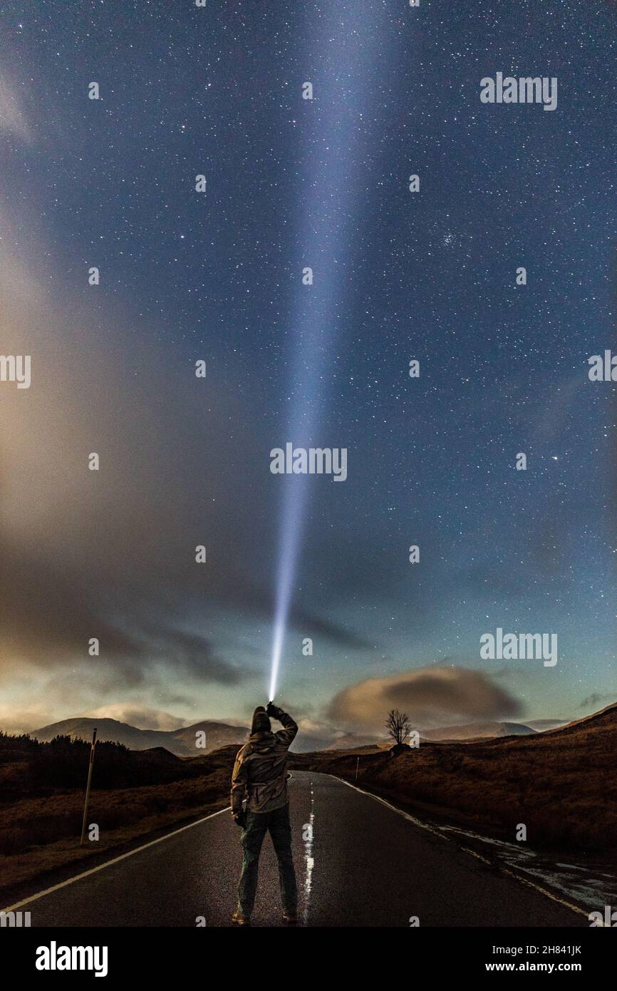 Man standing under stars at night hi-res stock photography and images ...