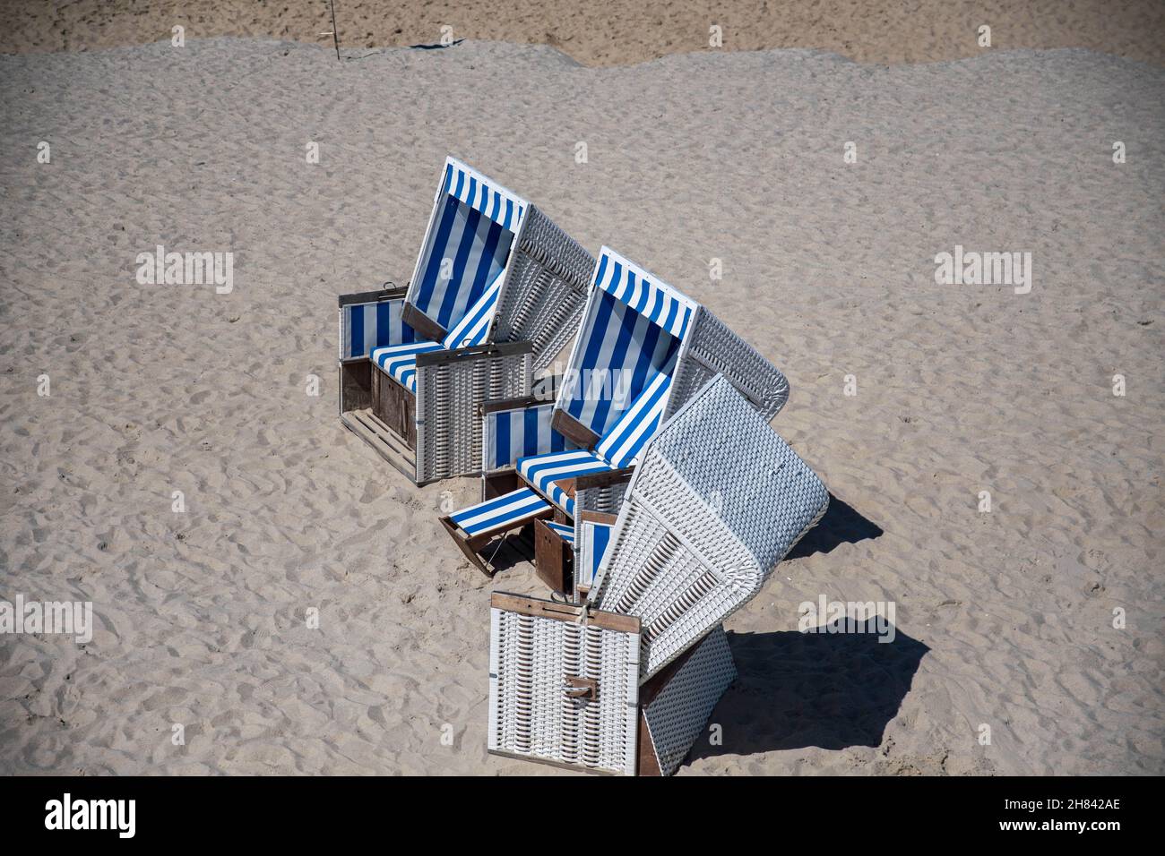 three beach chairs on the sandy beach Stock Photo - Alamy