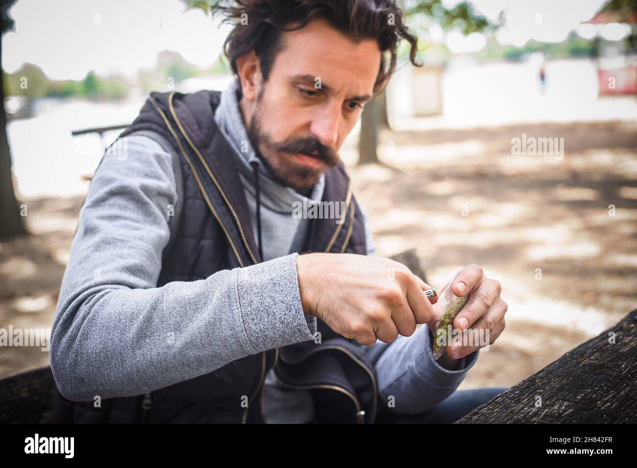 One friend shows the others marijuana weed packet ready to roll ...