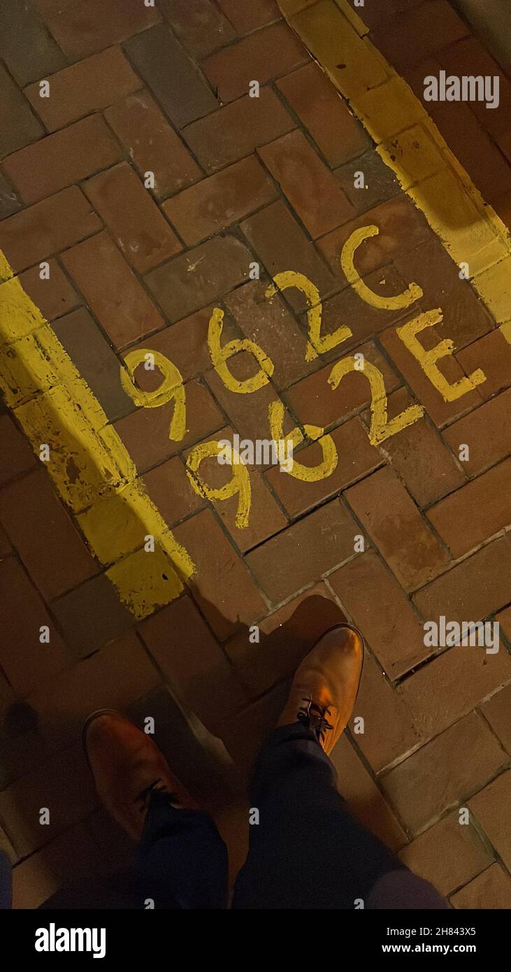 Marks help people line up at the bus stop in Hong Kong, route 962C and ...