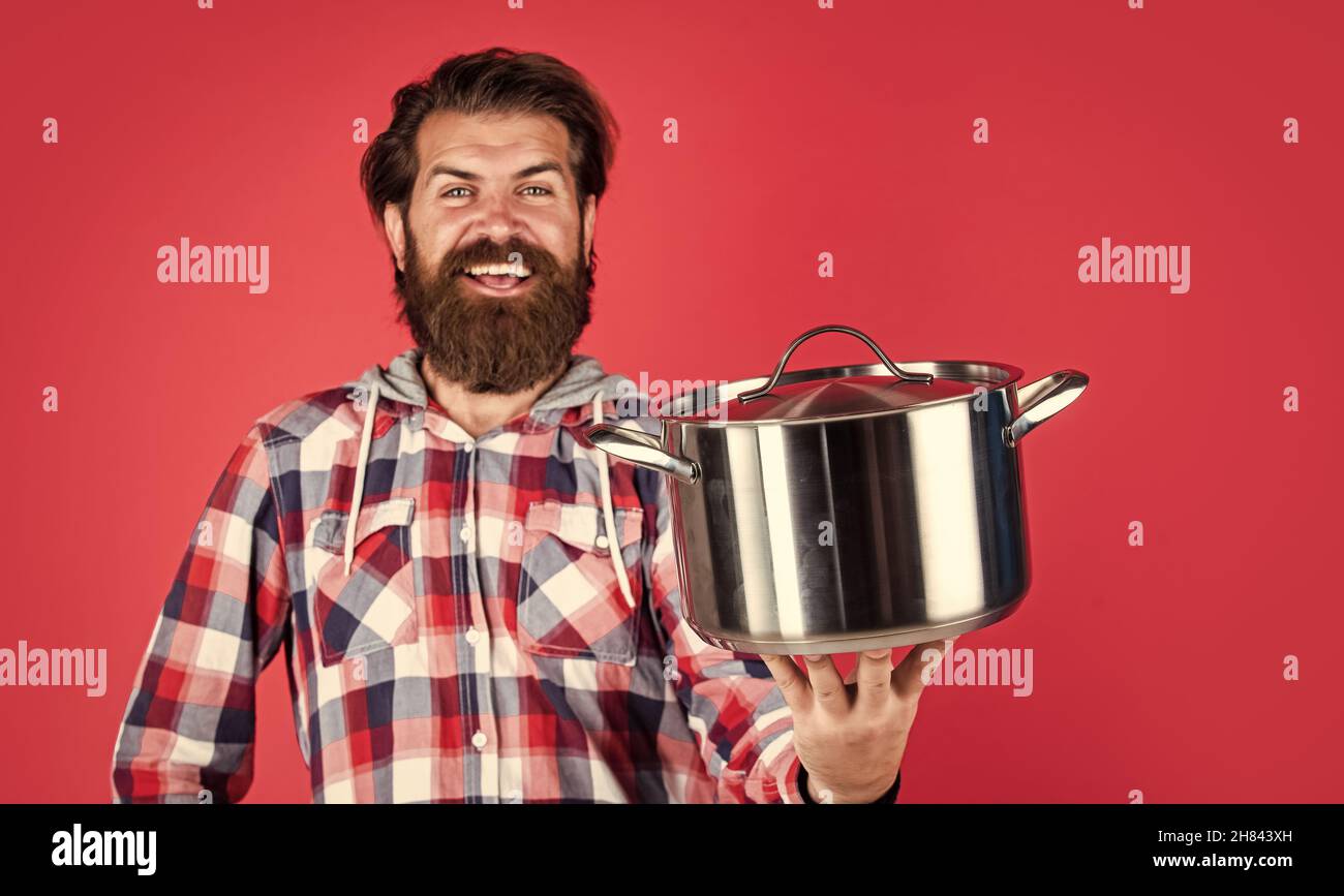 lets eat. man holding frying pan.. male chef kitchener cooking. hipster ...