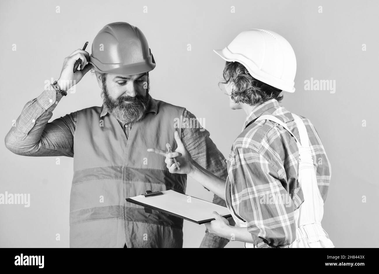engineers couple working together on building blueprint. work at ...