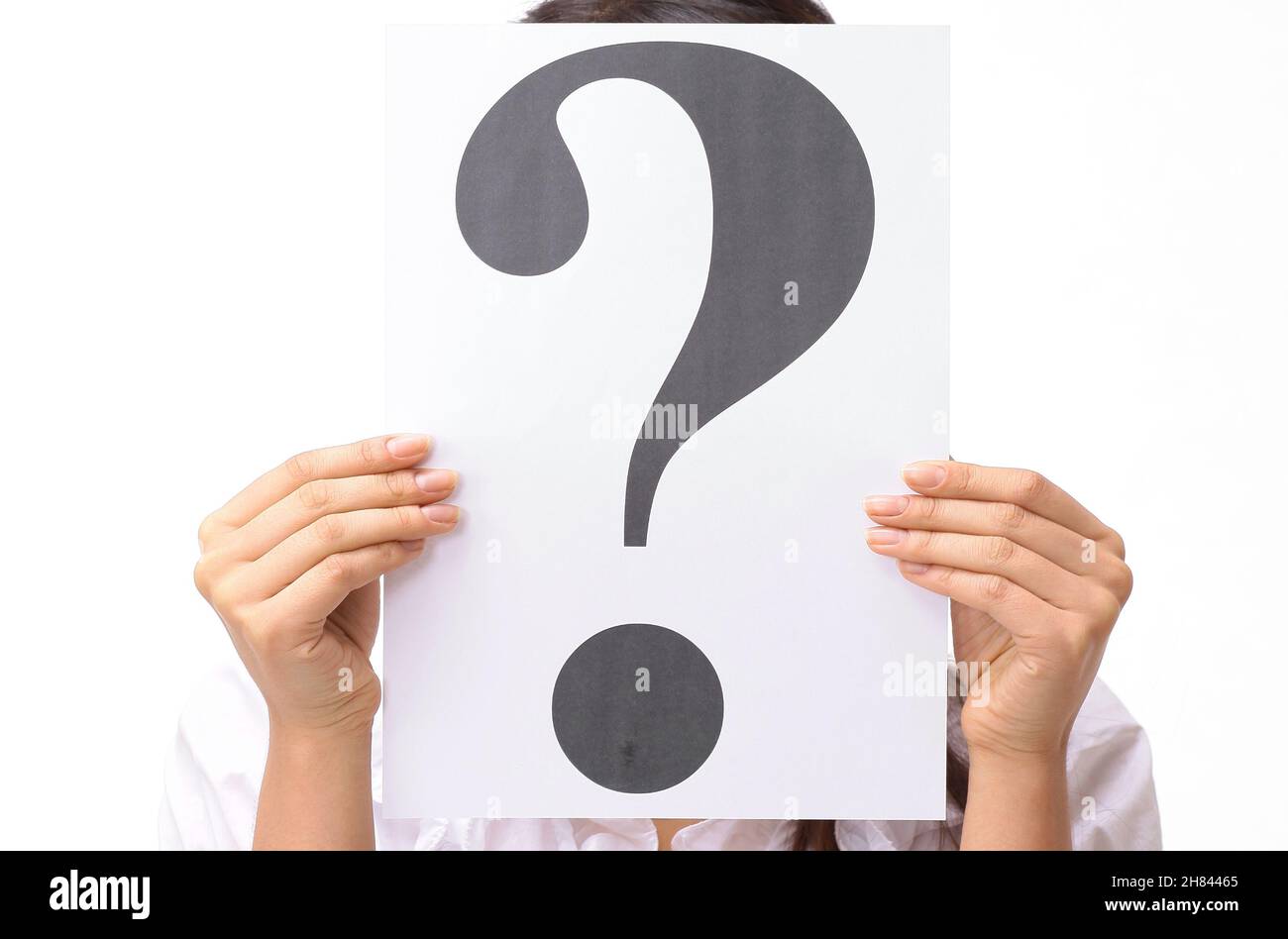 closeup.young woman showing a question mark Stock Photo - Alamy