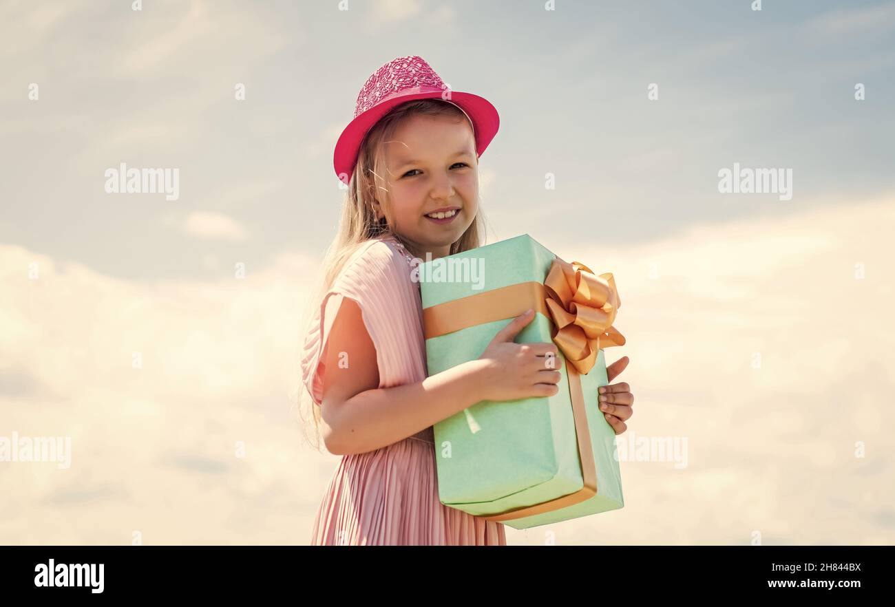 I like presents. beautiful teen girl with gift. kid fashion style ...