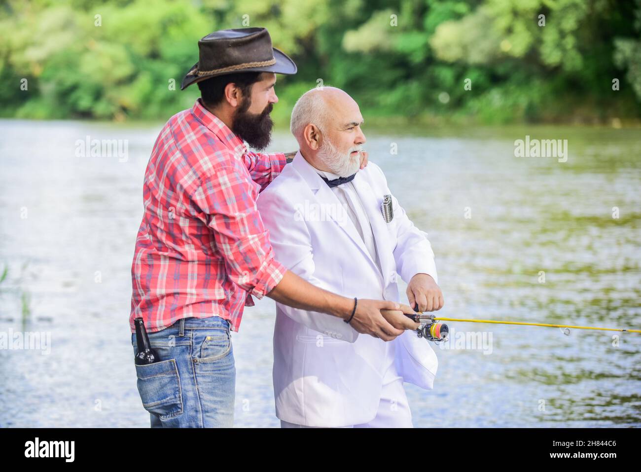 Learn to fish. Fishing skills. Men friends relaxing nature background ...