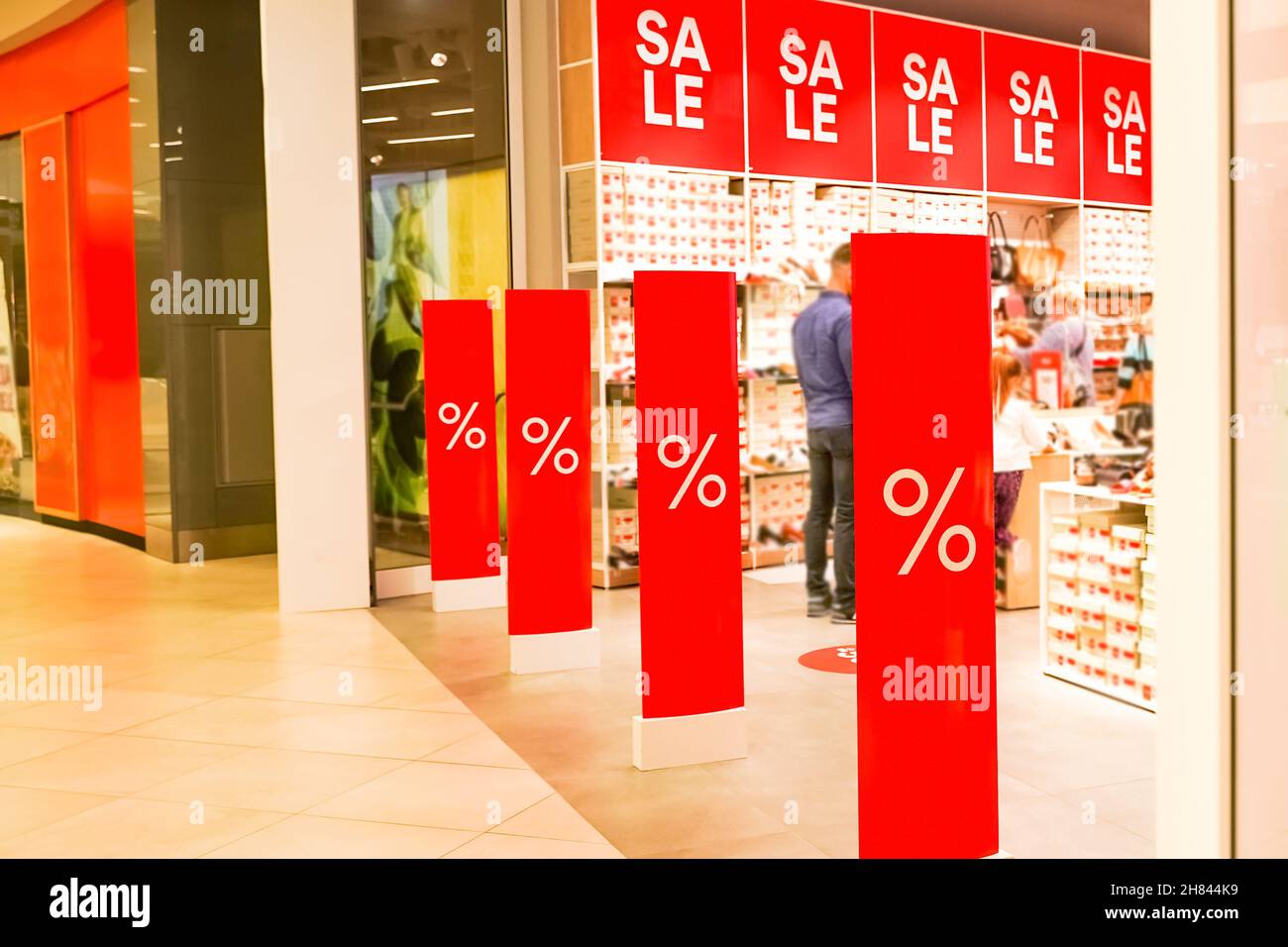 Red posters percent near store on Black Friday. Sale shopping season ...