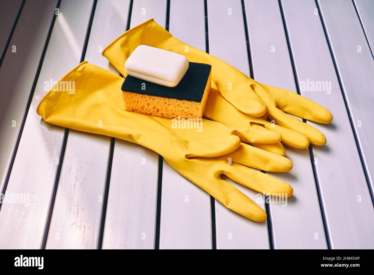 Cleaning set. Sponges, white soap and yellow gloves Stock Photo - Alamy