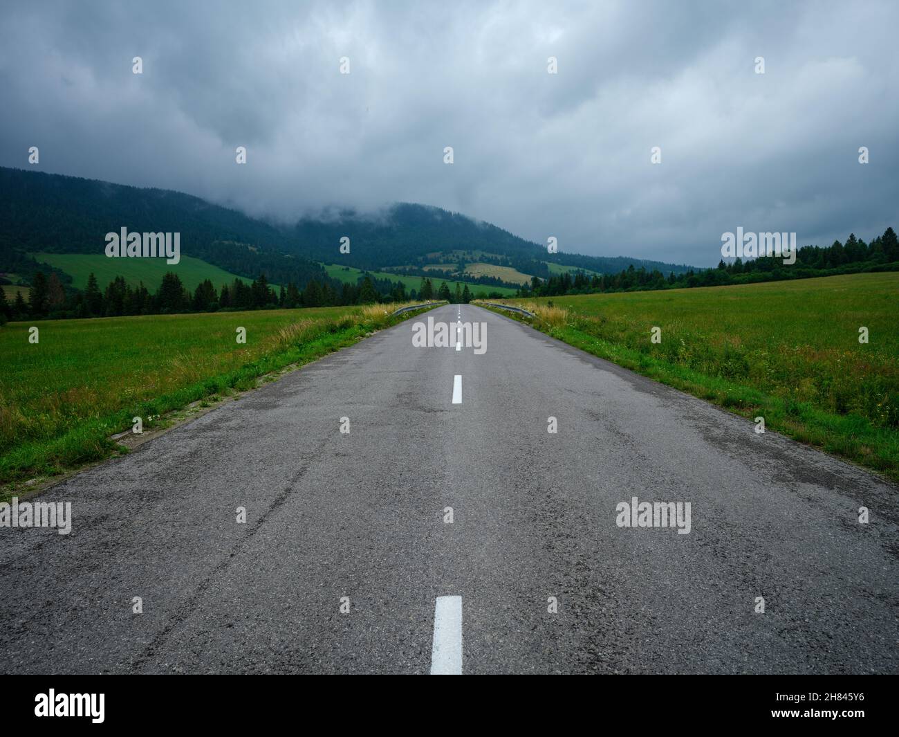 simple asphalt road in perspective with clear direction Stock Photo - Alamy