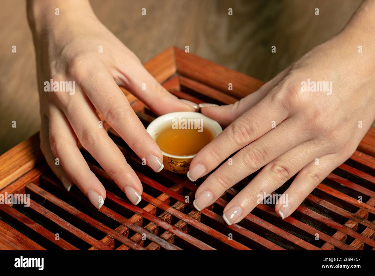 Close-up table for a tea ceremony utensils in the hands of a tea set ...